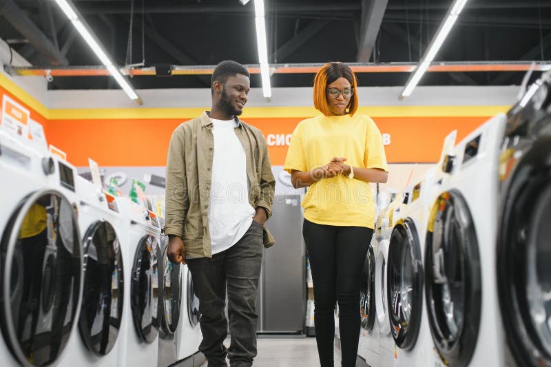 African American Couple Choosing Washing Machine, Electronics Store ...