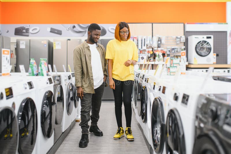 African American Couple Choosing Washing Machine, Electronics Store ...