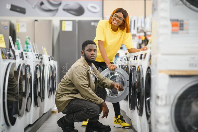 African American Couple Choosing Washing Machine at Electronics Store ...