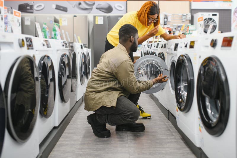 African American Couple Choosing Washing Machine at Electronics Store ...