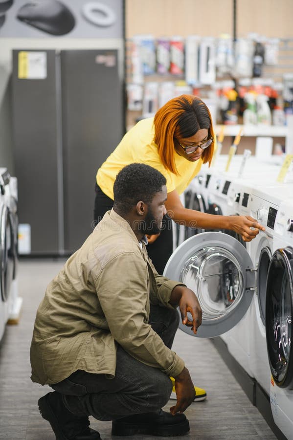 African American Couple Choosing Washing Machine, Electronics Store ...