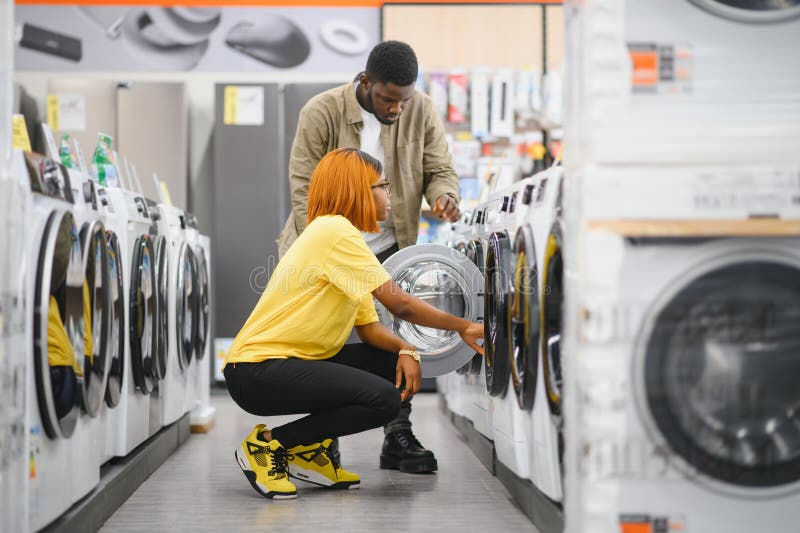 African American Couple Choosing Washing Machine at Electronics Store ...