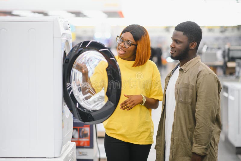 African American Couple Choosing Washing Machine, Electronics Store ...