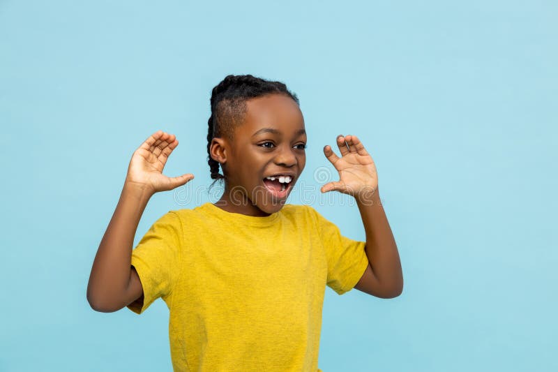 African American Cute Boy Looking Excited and Contented Stock Photo ...