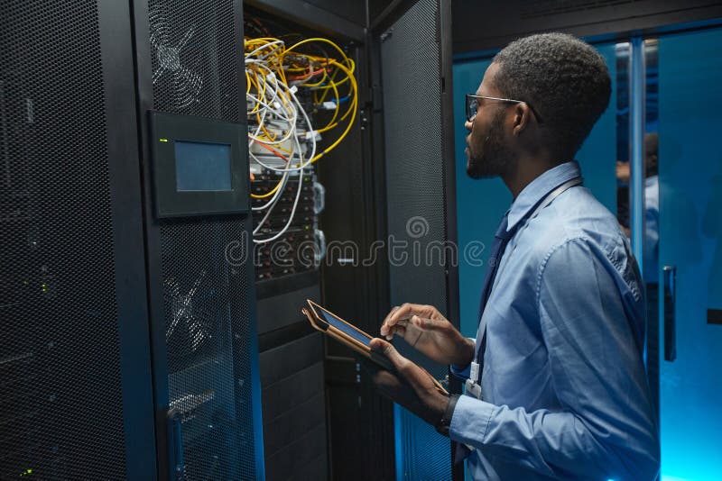 African American Data Engineer in Server Room Stock Photo - Image of ...