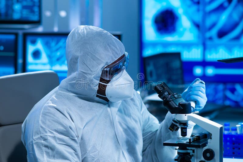 African-american Doctor in Protective Suit is Doing a Science ...
