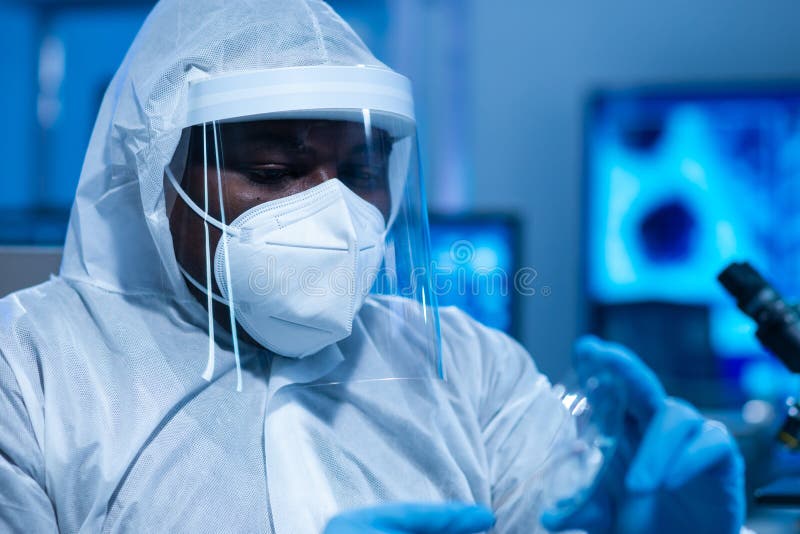 African-american Doctor in Protective Suit is Doing a Science ...