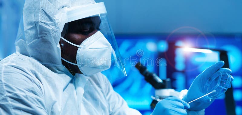 African-american Doctor in Protective Suit is Doing a Science ...