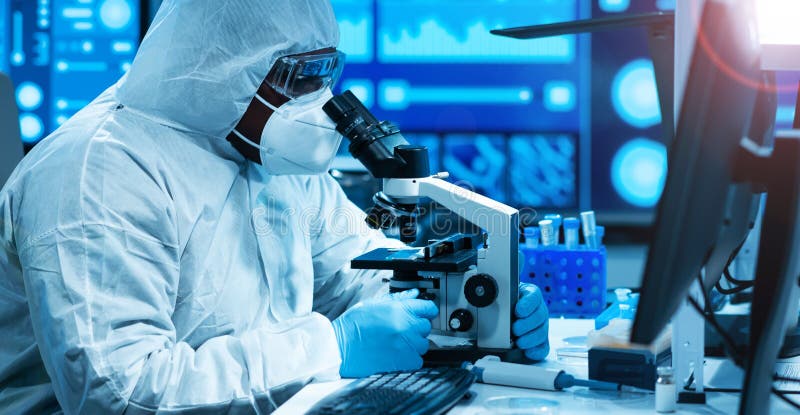 African-american Doctor in Protective Suit is Doing a Science ...