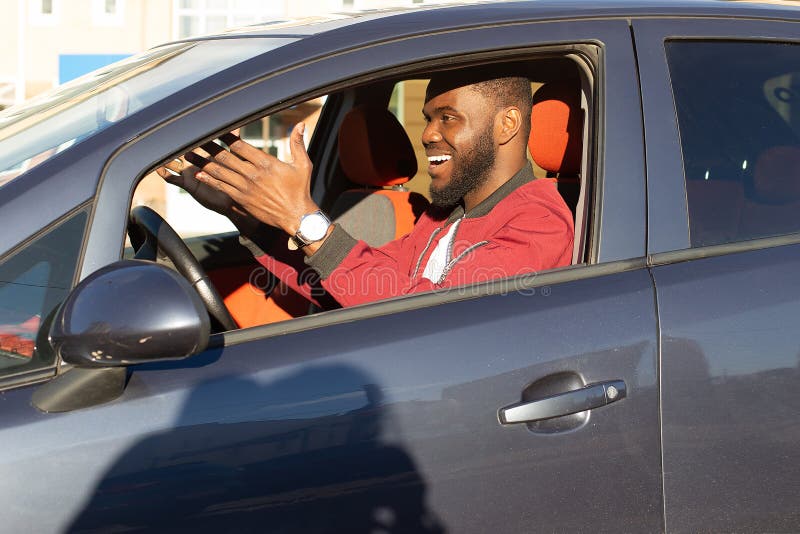 African-American Driving a Blue Car Stock Photo - Image of formal, blue ...