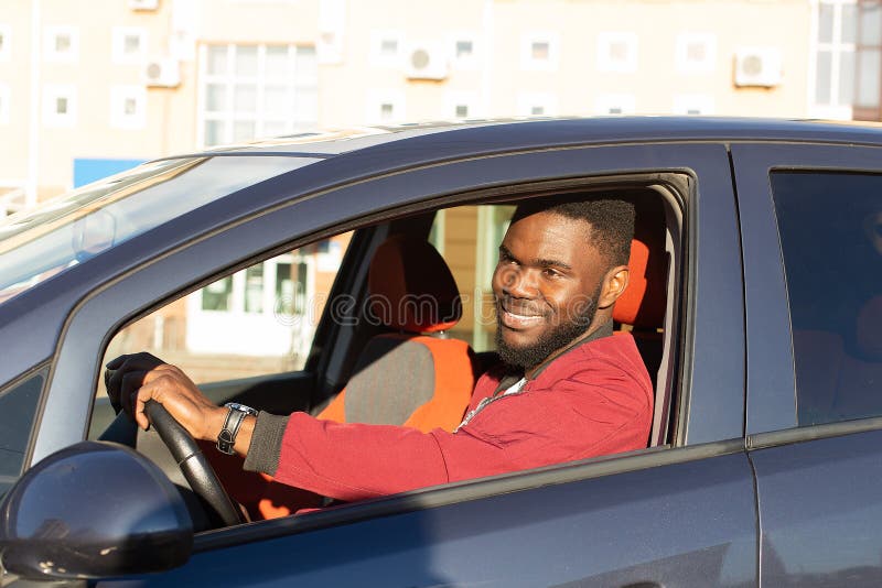 African-American Driving a Blue Car Stock Image - Image of inside ...