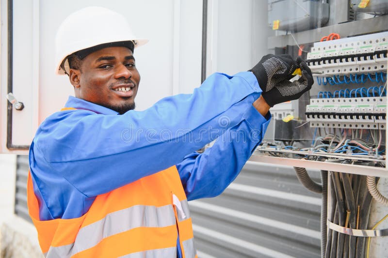 African American Electrical Engineer Approving Power Distribution Box ...