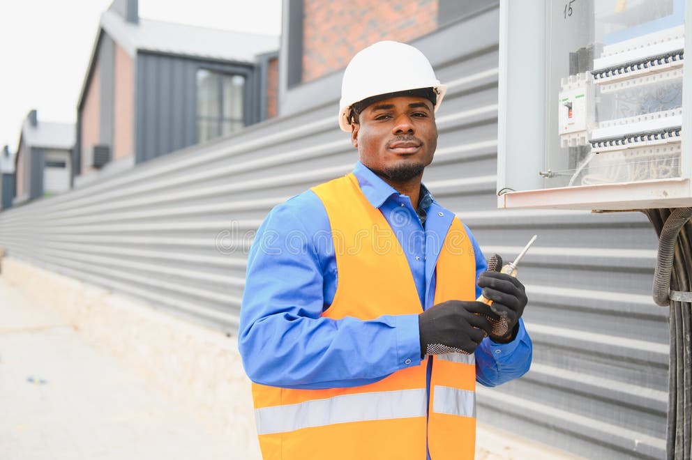 African American Electrical Engineer Approving Power Distribution Box ...