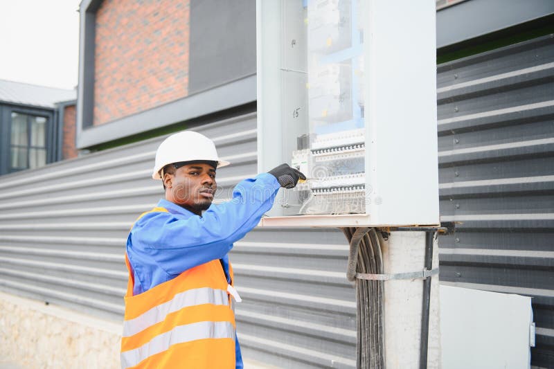African American Electrical Engineer Approving Power Distribution Box ...