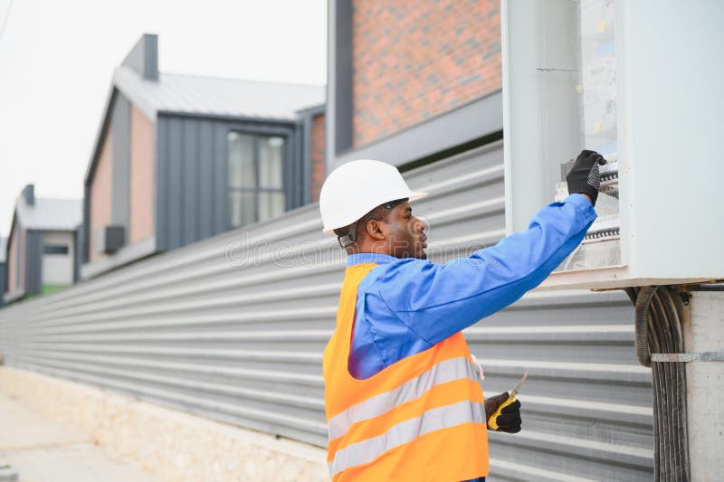 African American Electrical Engineer Approving Power Distribution Box ...