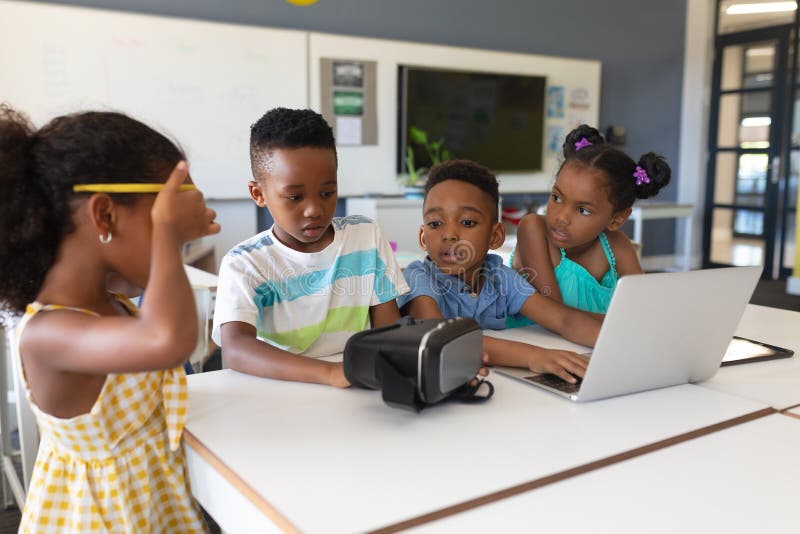 African American Elementary School Students Using Vr Glasses and Laptop ...
