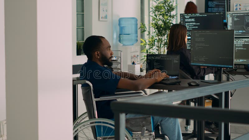 African American It Engineer With Disability Typing Code In It