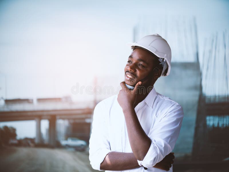 African-american Engineer in Helmet Thinking with Ideas and Architect ...