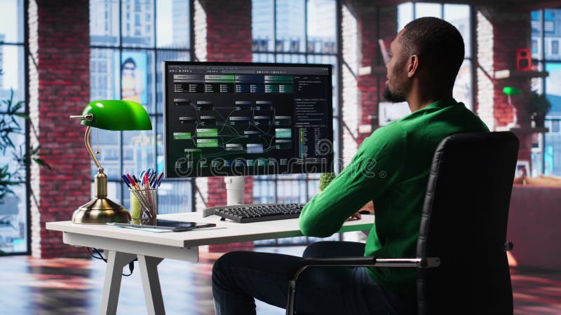 African American Engineer at Home Working on Visual Coding on Terminal ...