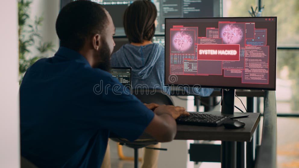 African American it Engineer Writing Code Encountering Hacking Alert on Computer Stock Photo ...