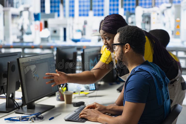 African American Engineering Team Doing Quality Control on Computer ...