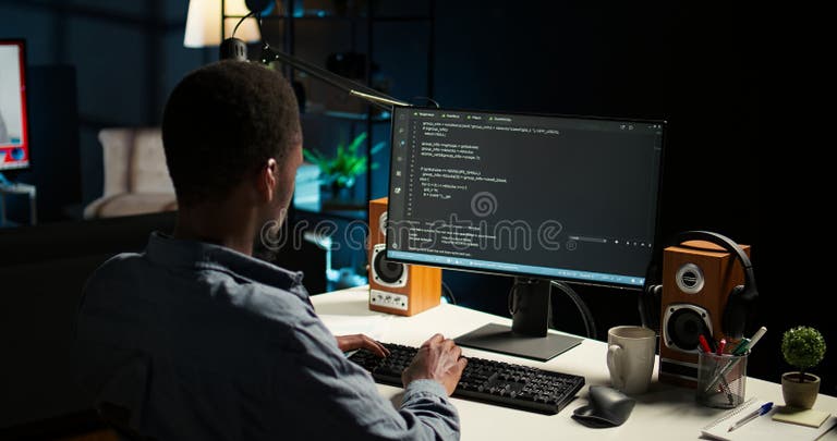 African American Expert at Desk Using Pc for Programming and Data ...