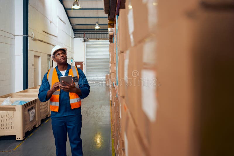 African American Factory Worker Checking Stock Inventory Using Digital ...