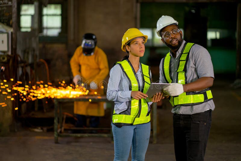 African American Factory Workers Stand and Discuss about Their Work in ...