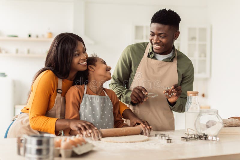 African American Family Baking Using Forms Making Cookies in Kitchen ...