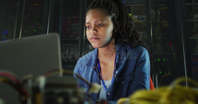 African American Computer Technicians Using Tablet Working in Business ...