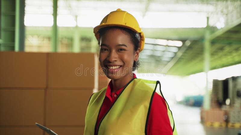 A Smiling African Female Construction Worker Standing in Construction ...
