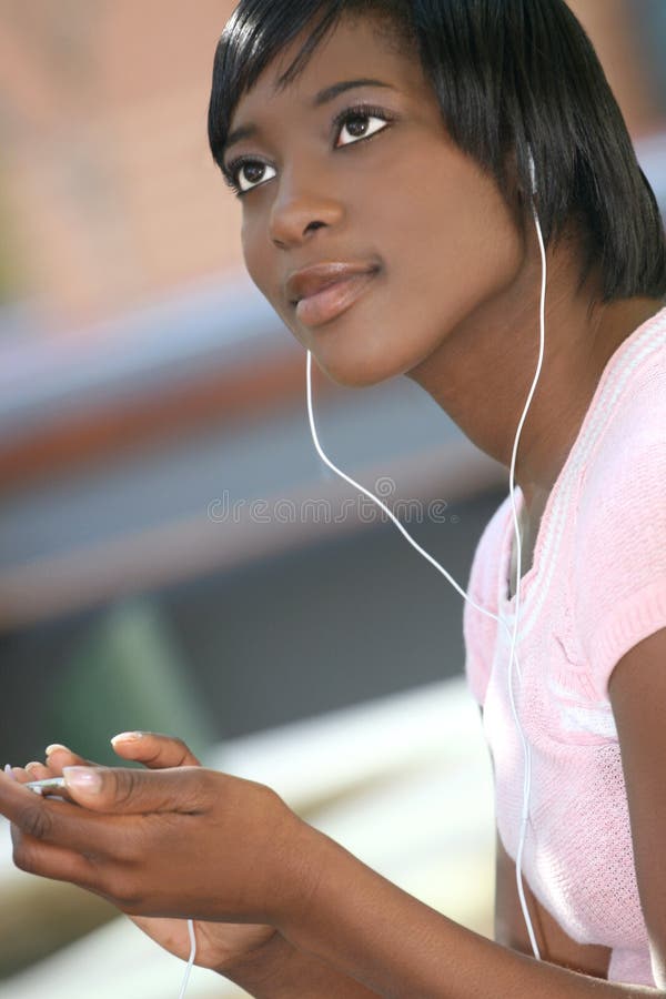 African-American Female with Mp-3 Player Stock Photo - Image of player ...
