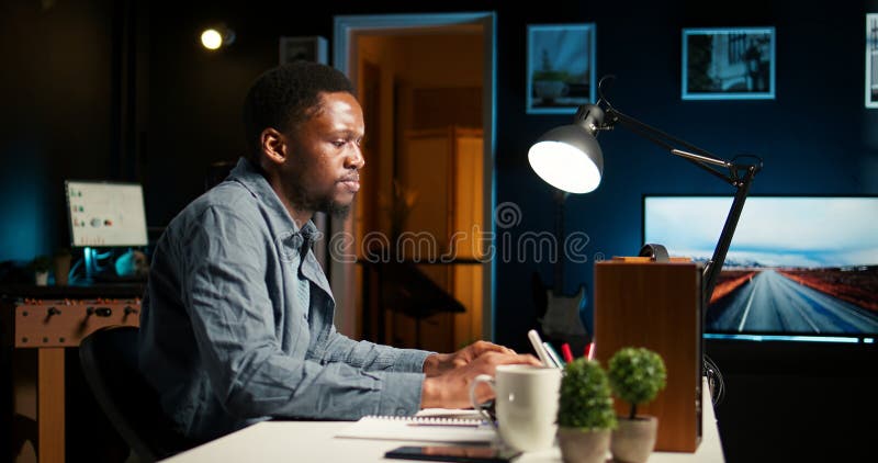 African American Freelancer Researching Data Driven Topics at Home Workstation Stock Photo ...