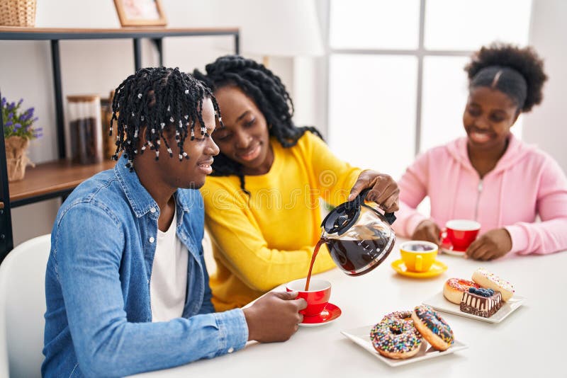 African American Friends Having Breakfast Sitting on Table at Home ...