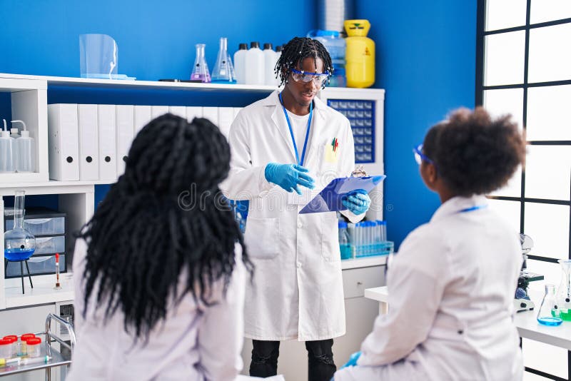 African American Friends Scientists Explaining Experiment at Laboratory ...