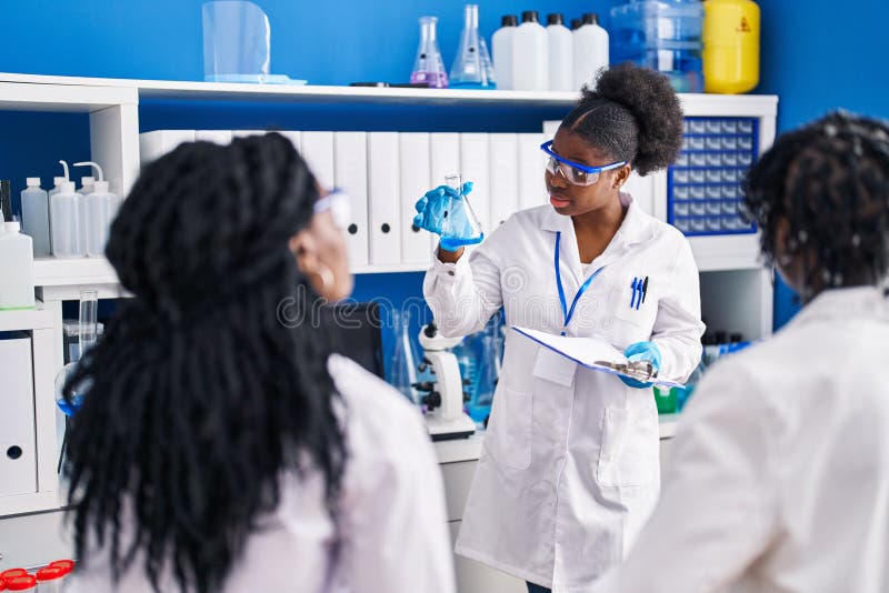African American Friends Scientists Explaining Experiment at Laboratory ...