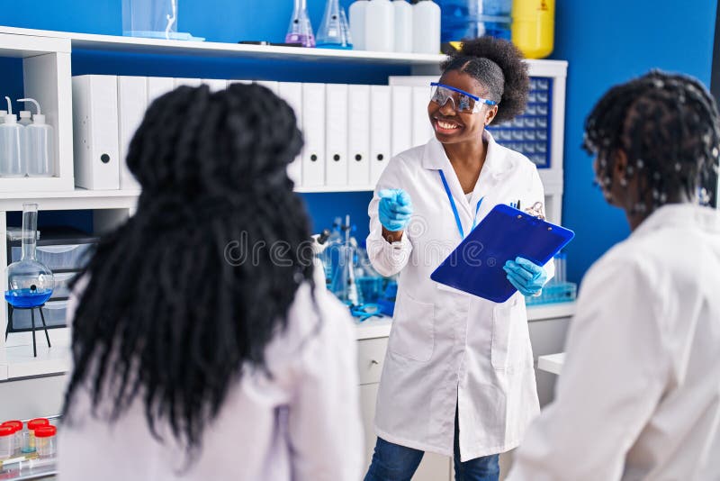 African American Friends Scientists Explaining Experiment at Laboratory ...