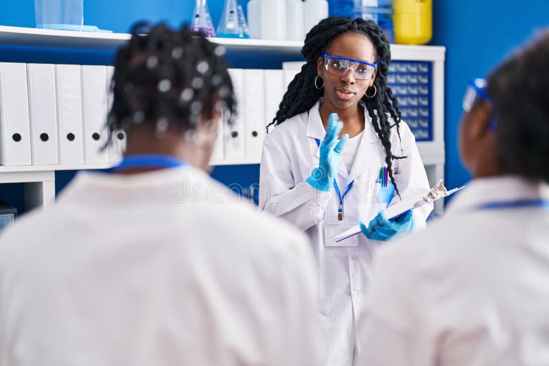 African American Friends Scientists Explaining Experiment at Laboratory ...