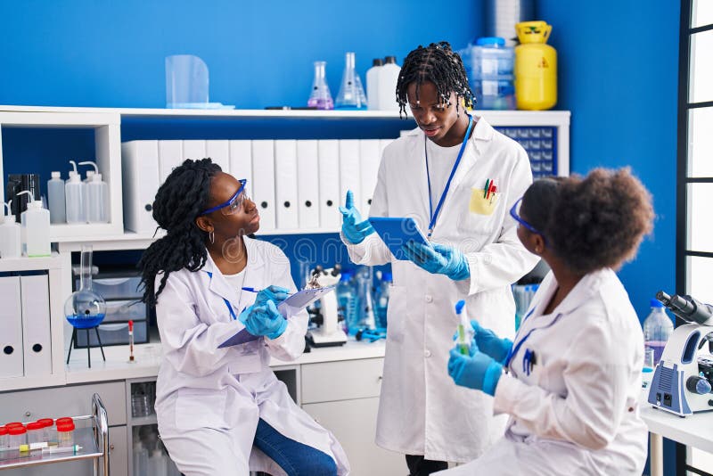 African American Friends Scientists Using Touchpad Working at ...