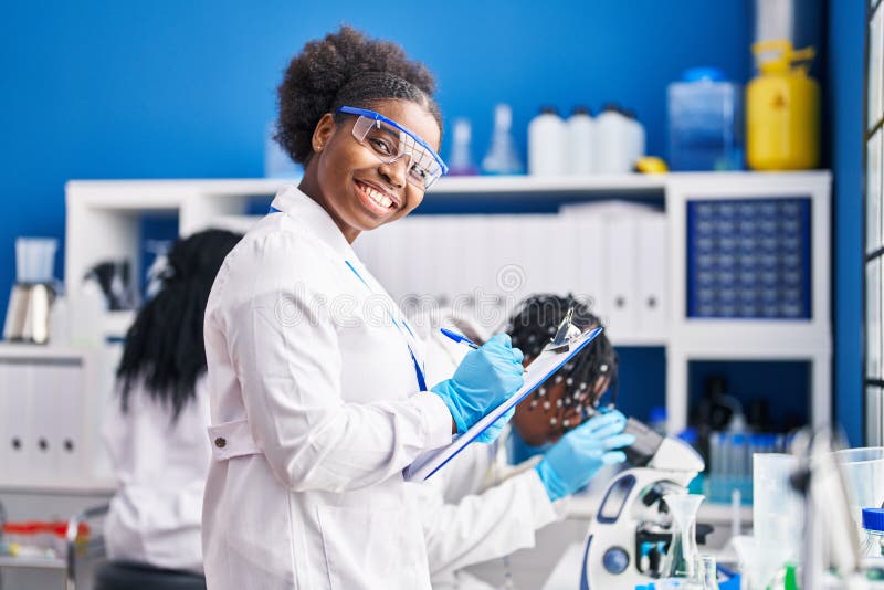 African American Friends Scientists Writing on Clipboard Working at ...