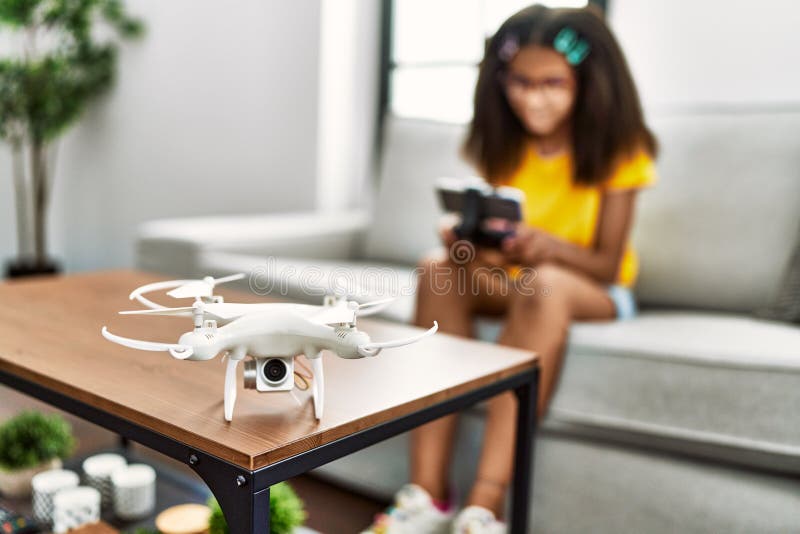 African American Girl Smiling Confident Using Drone at Home Stock Image ...
