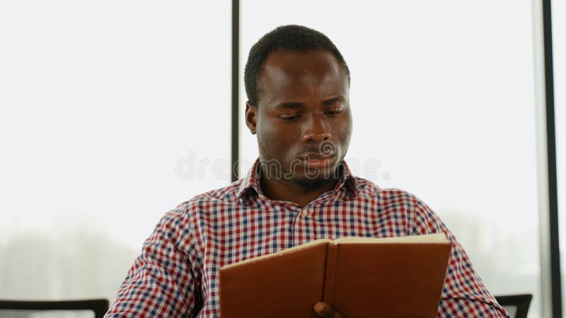 African American Guy Holding Book, University Student Studying ...