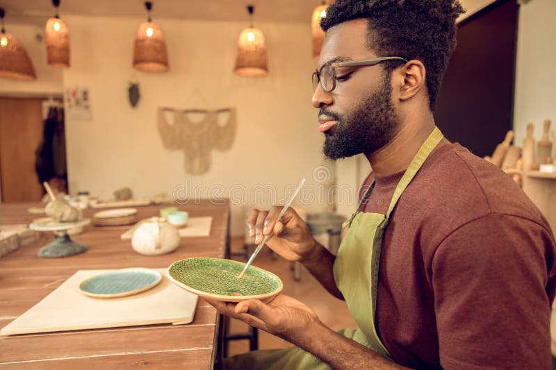 African American Guy Working with Pottery in His Workshop Stock Photo ...