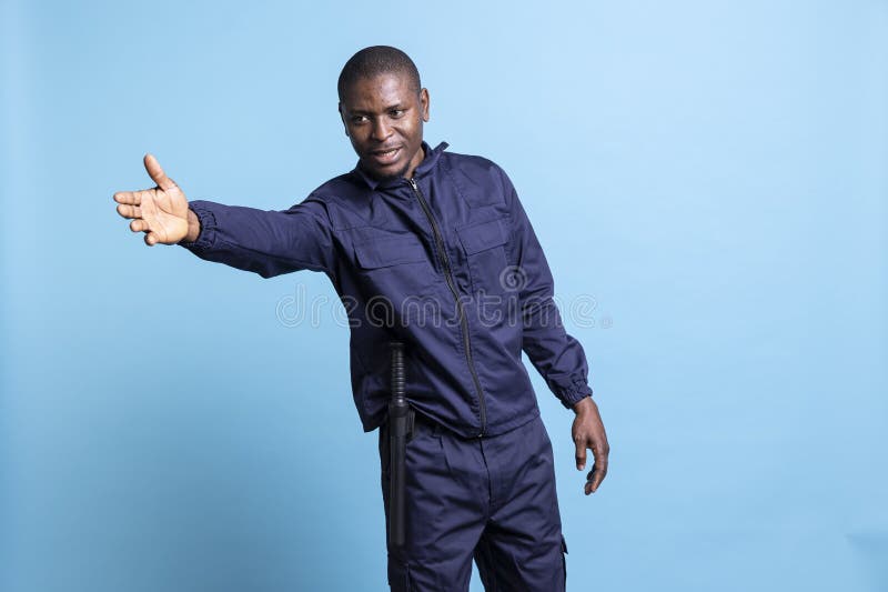 African American Guy Works As a Security Guard in Front of the Camera ...