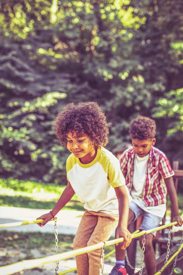African American Kids Playing on Bridge Stock Photo - Image of close ...