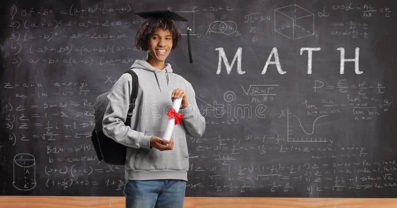 African American Male Student Holding a Diploma in Front of a ... African American Male Student Holding a Diploma in Front of a ...