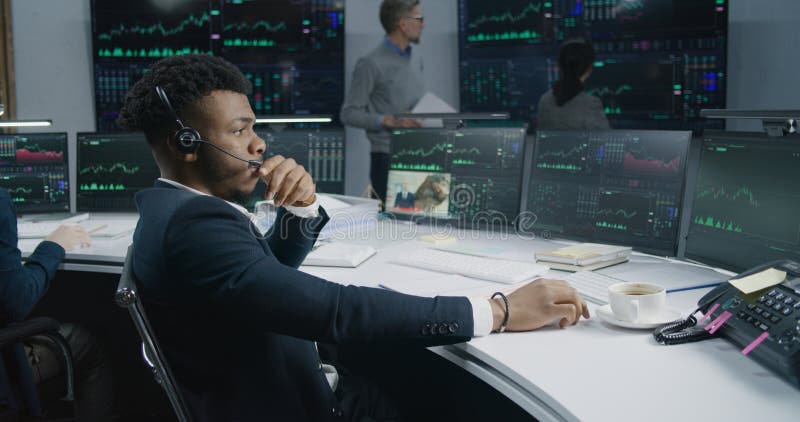 African American Trader Analyzes Market Charts Stock Photo - Image of ...