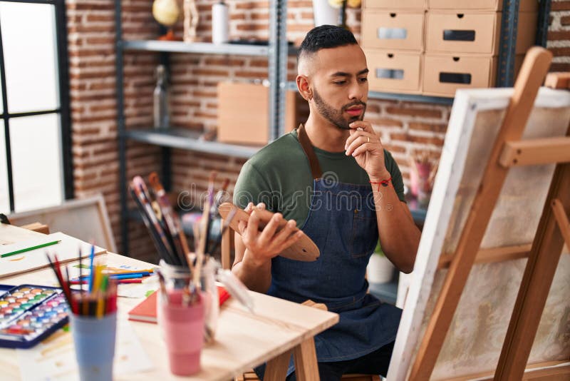 African American Man Artist Drawing with Doubt Expression at Art Studio ...