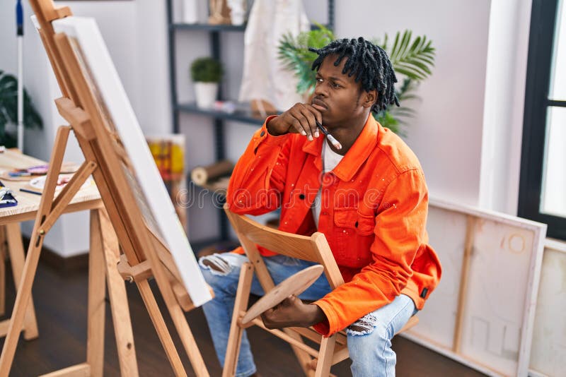 African American Man Artist Looking Draw with Doubt Expression at Art ...