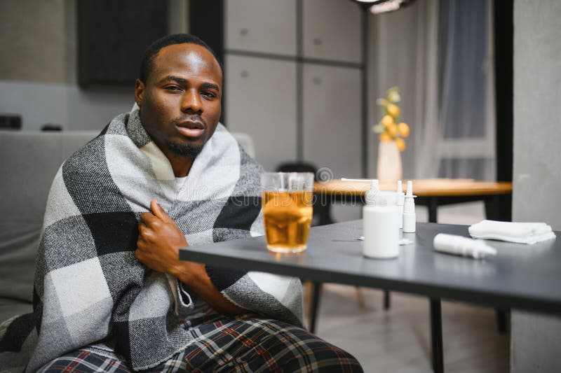 An African American Man is Being Treated for a Cold and Flu at Home ...